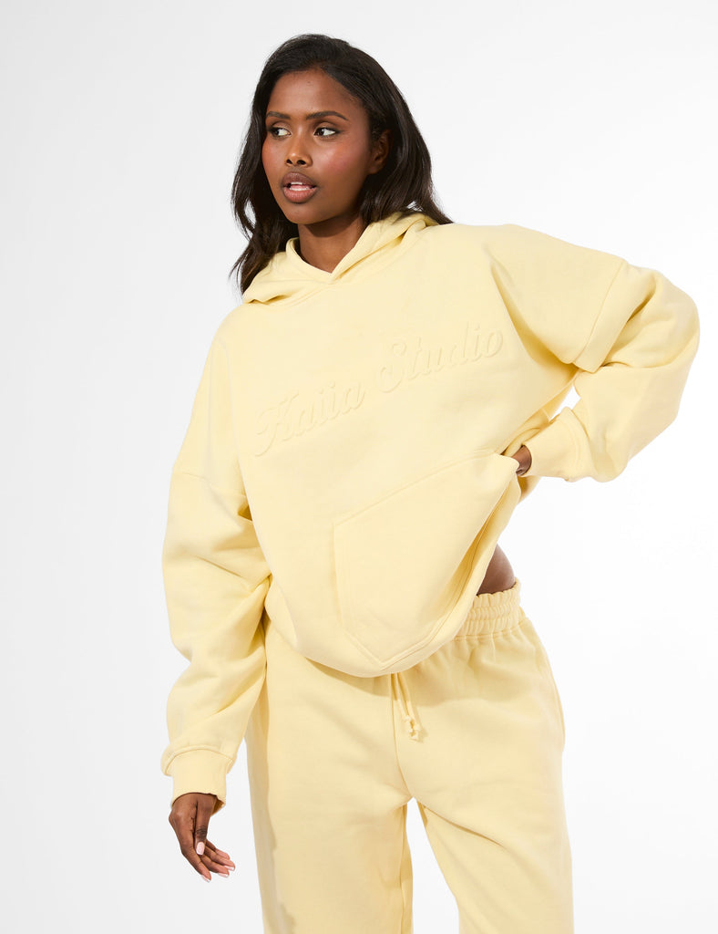 Kaiia Studio Embossed Script Logo Oversized Hoodie Banana Milkshake ...