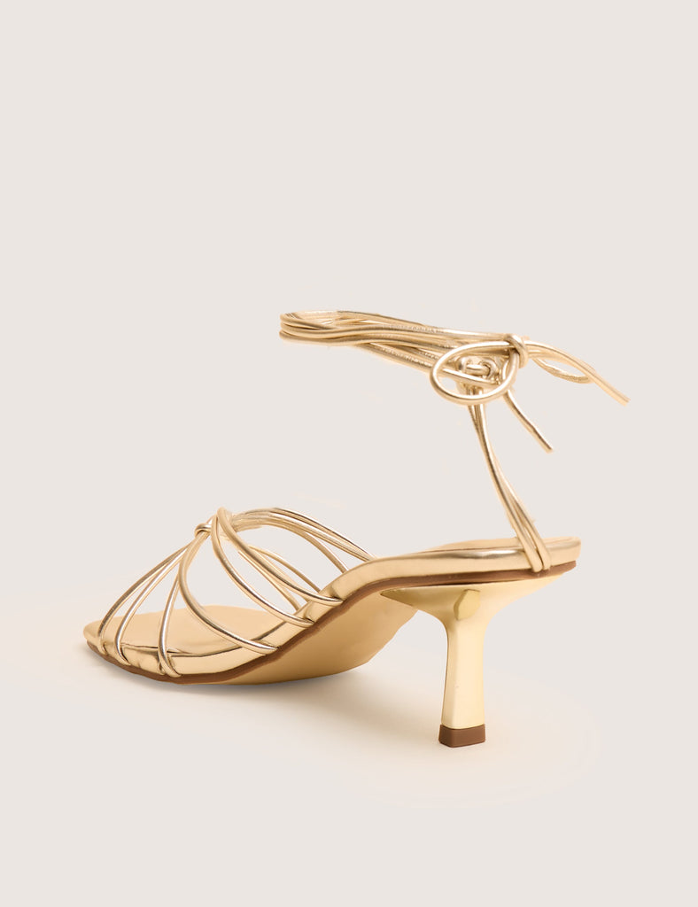 Nora Wide Fit Gold Pu Lace Up Strappy Mid Heels | Public Desire